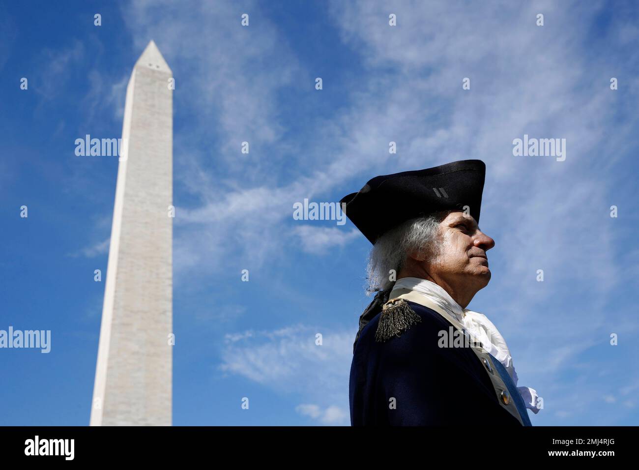 John Lopes, playing the part of President George Washington, stands ...