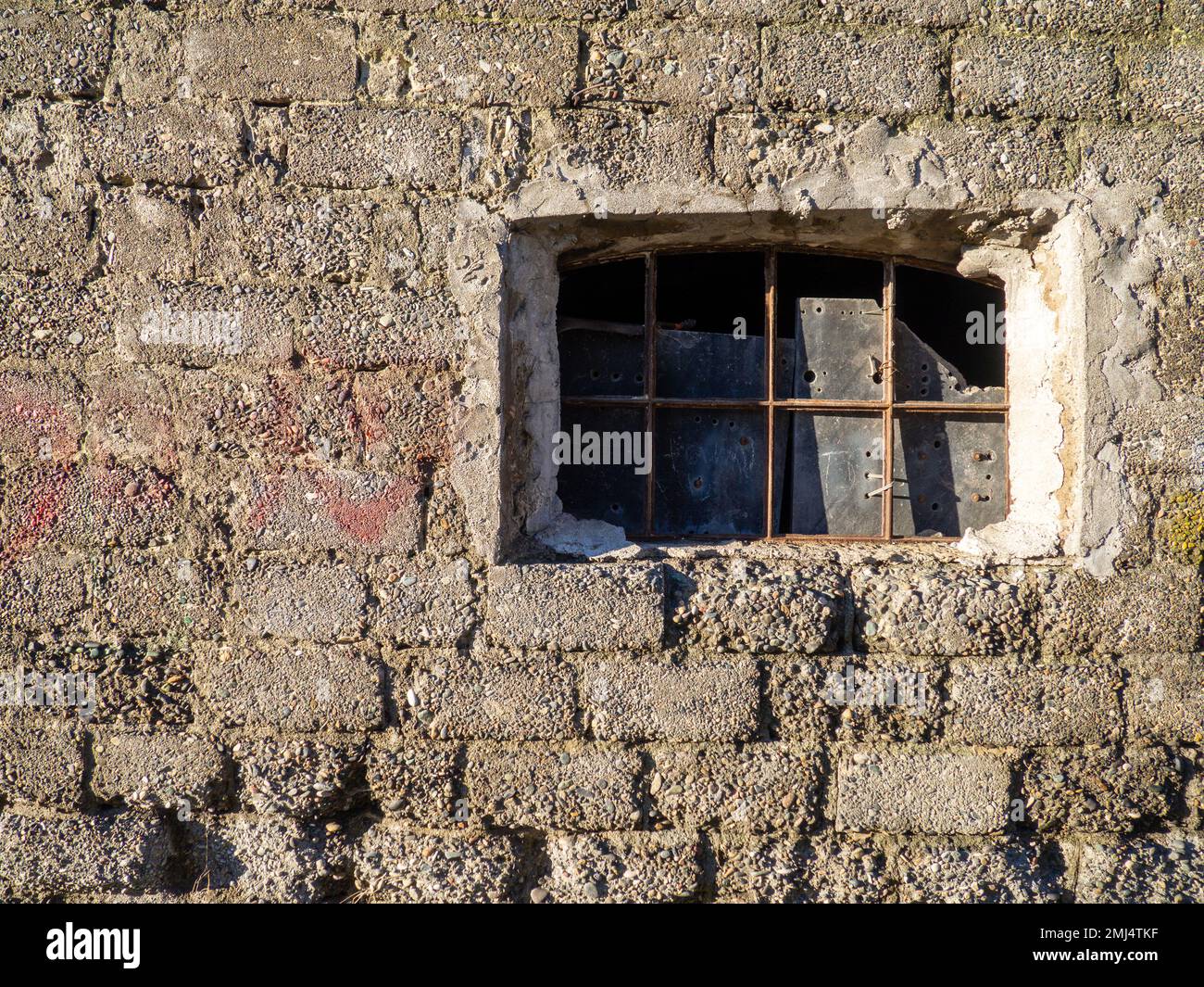 Window in a destroyed building. Remained a wall from the house. The ...