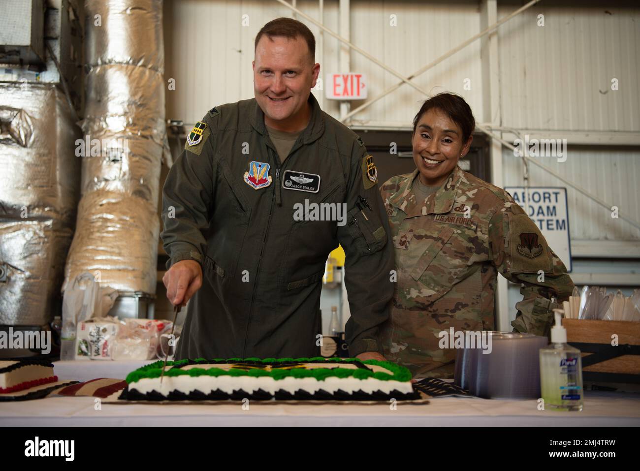 Col. Jason Bialon, 9th Operations Group commander, cuts the ceremonial ...