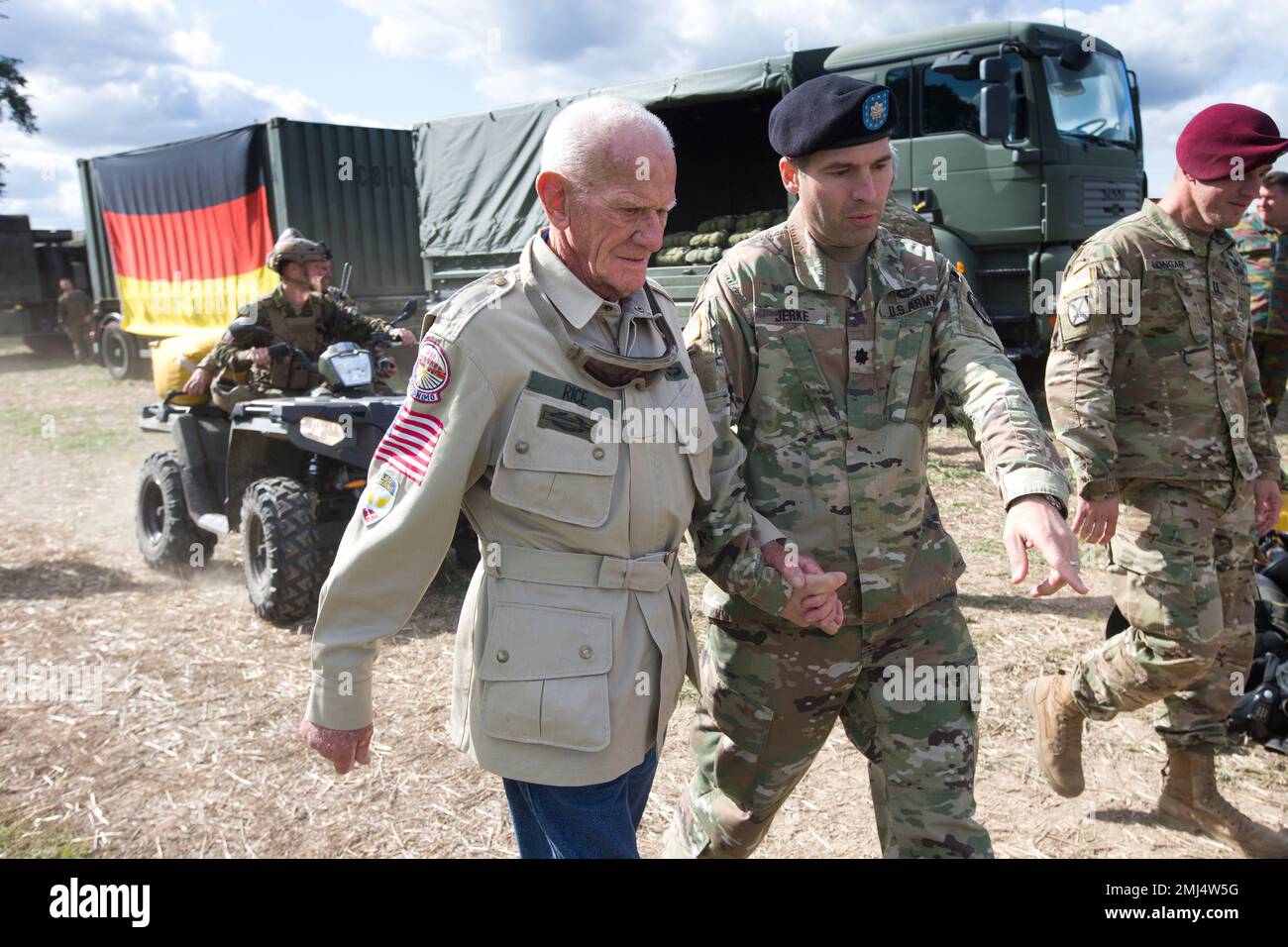 Tom Rice, a 98-year-old American WWII veteran, is escorted by a 101st ...