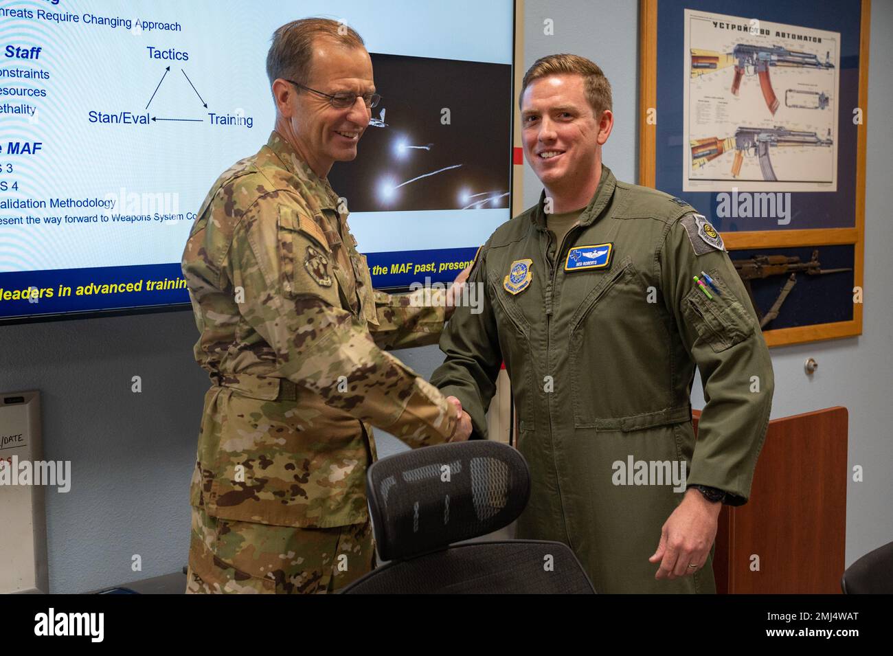 Maj. Gen. Corey Martin, 18th Air Force commander, coins Capt. Nathaniel ...