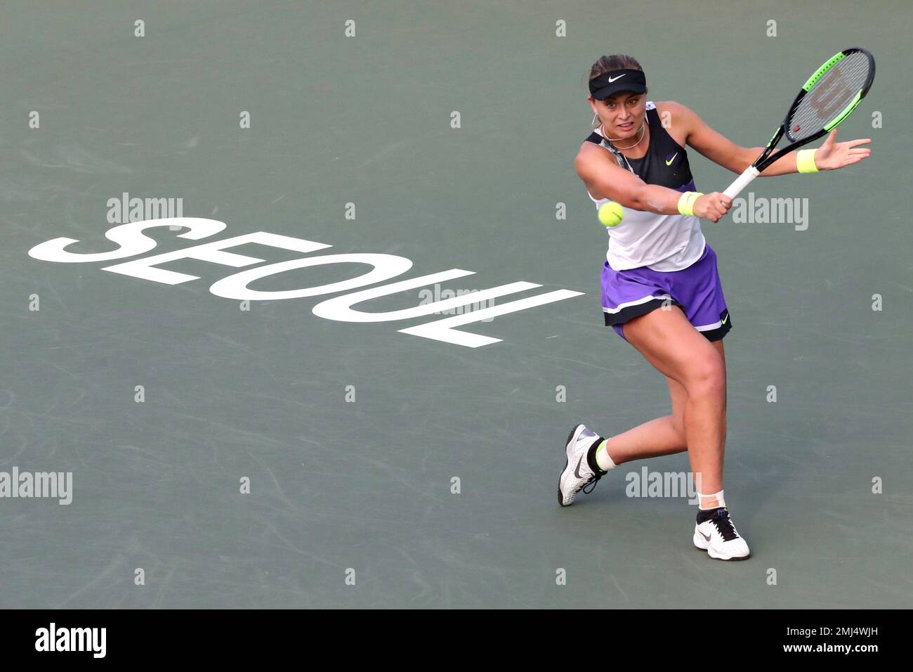Paula Badosa of Spain returns a shot to Patricia Maria Tig of Romania ...