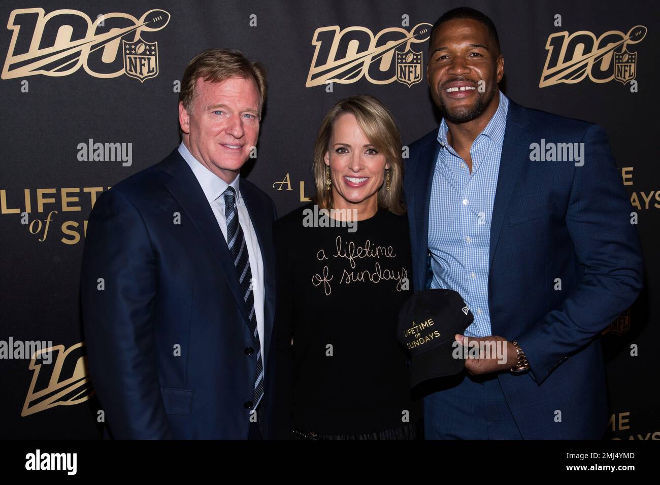 Roger Goodell, left, Jane Skinner Goodell and Michael Strahan attend a ...