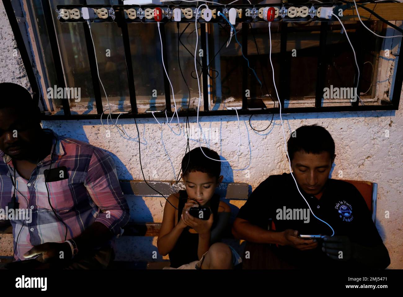 In this July 30, 2019, photo, migrants from Africa and Latin America ...