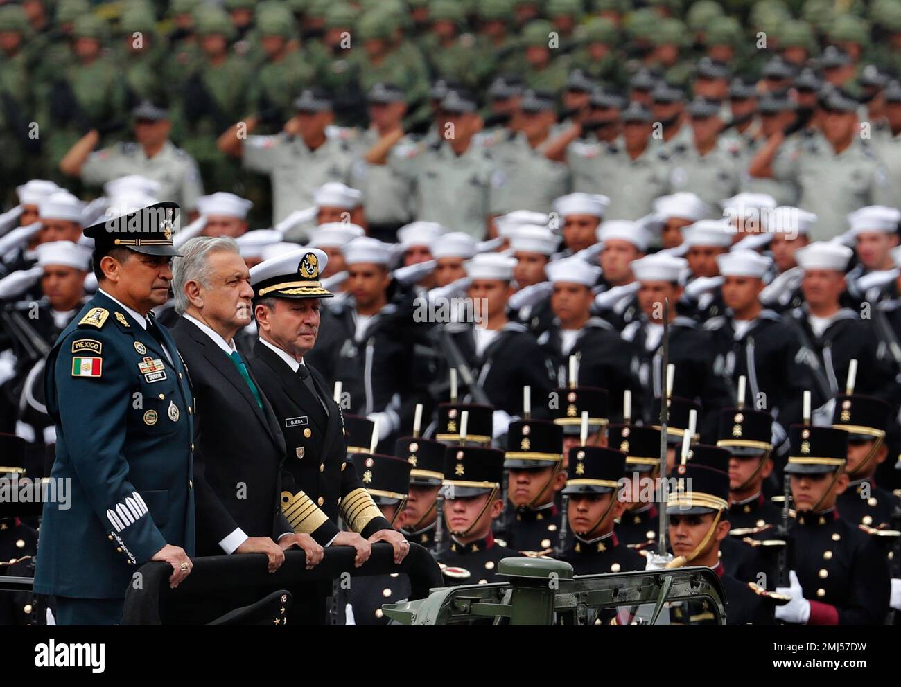 Mexican President Andres Manuel Lopez Obrador, center, stands with ...
