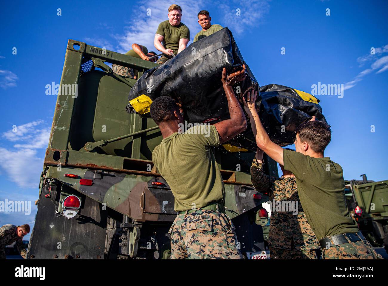 U.S. Marines with Marine Wing Support Squadron (MWSS) 171 load forward ...