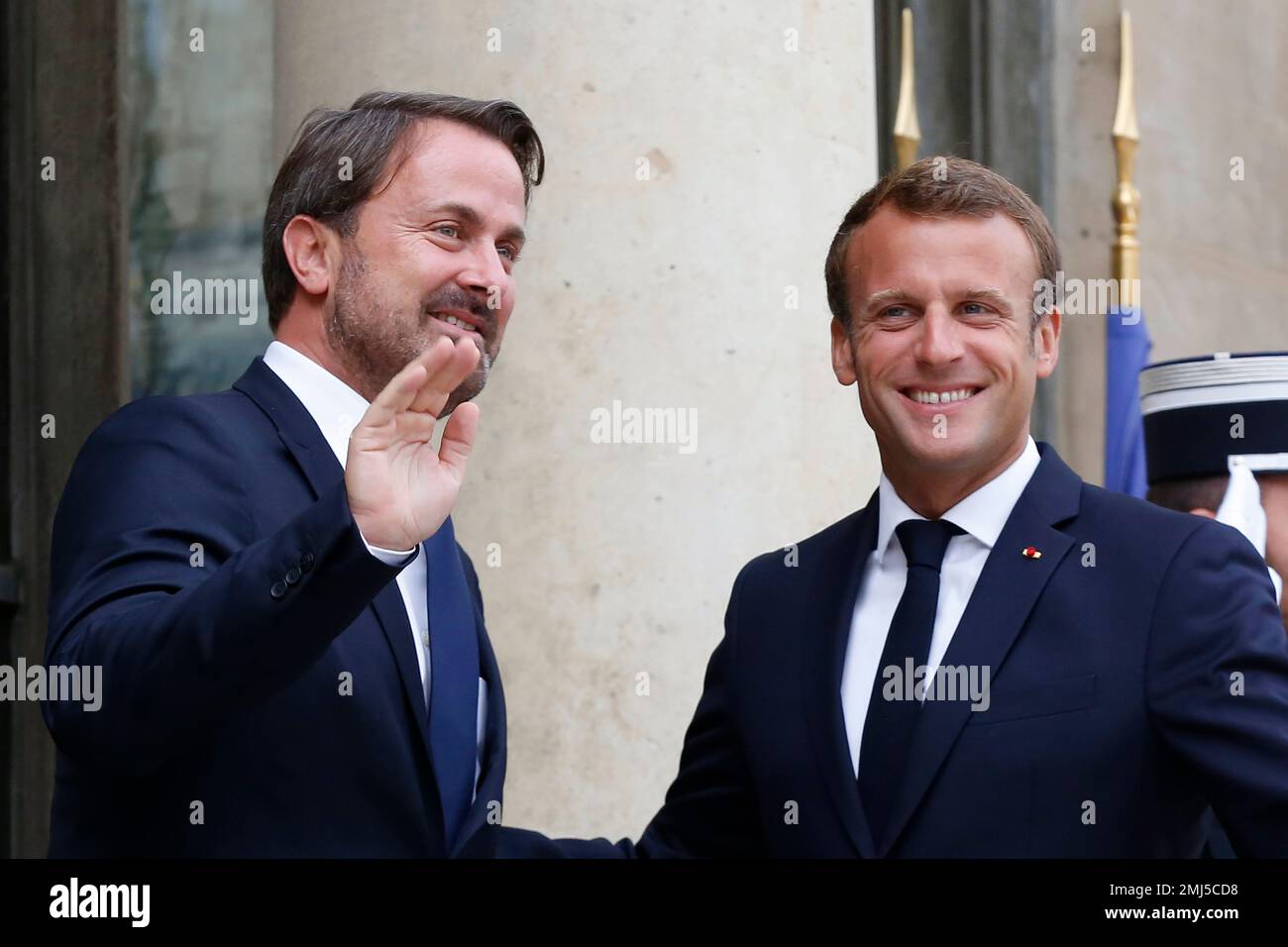 France's President Emmanuel Macron, right, welcomes Luxembourg's Prime ...