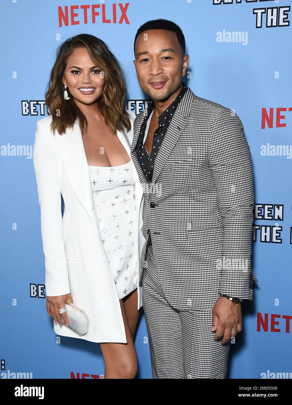 Chrissy Teigen, left, and John Legend arrive at the Los Angeles ...