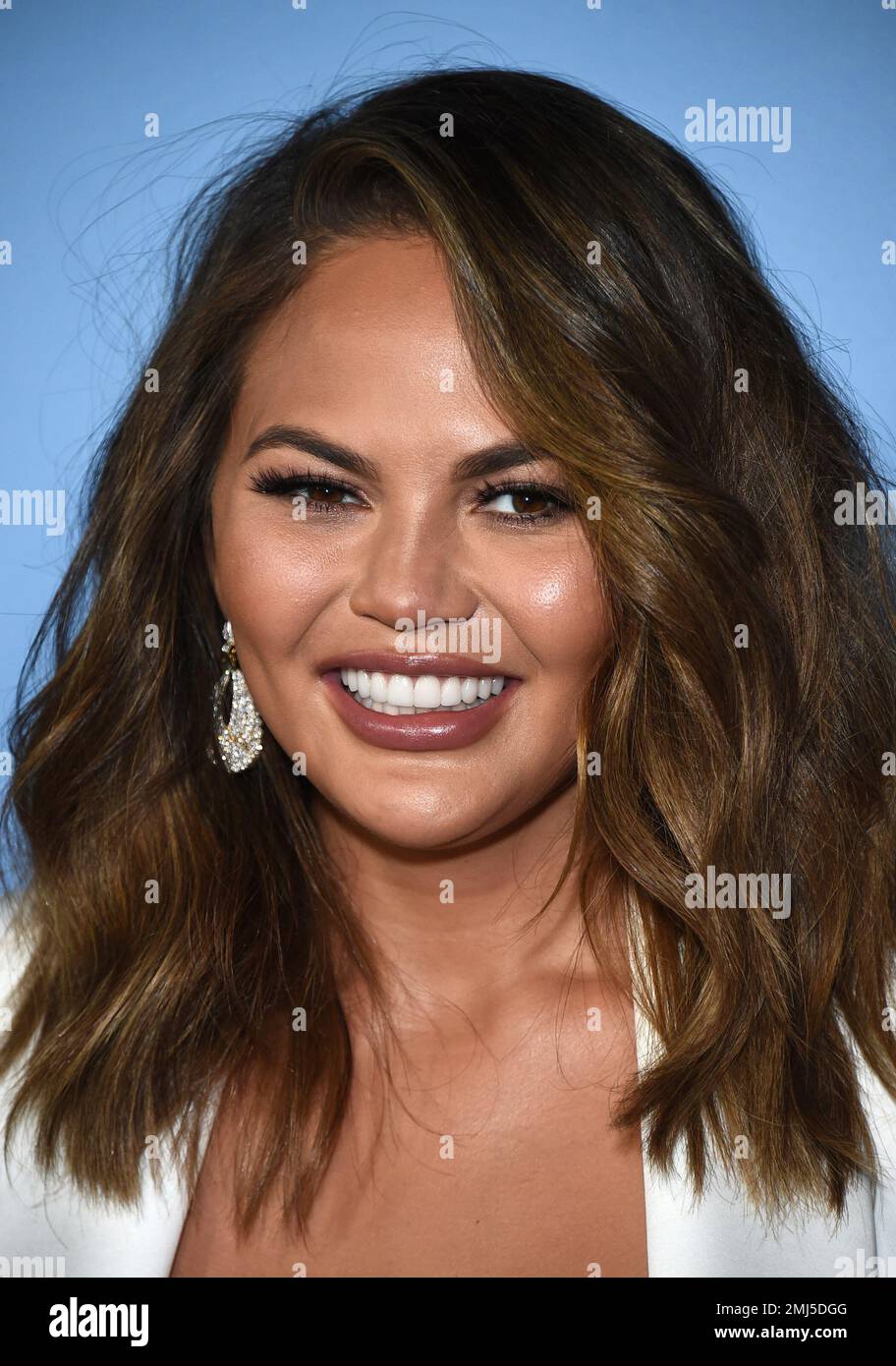Chrissy Teigen arrives at the Los Angeles premiere of "Between Two ...
