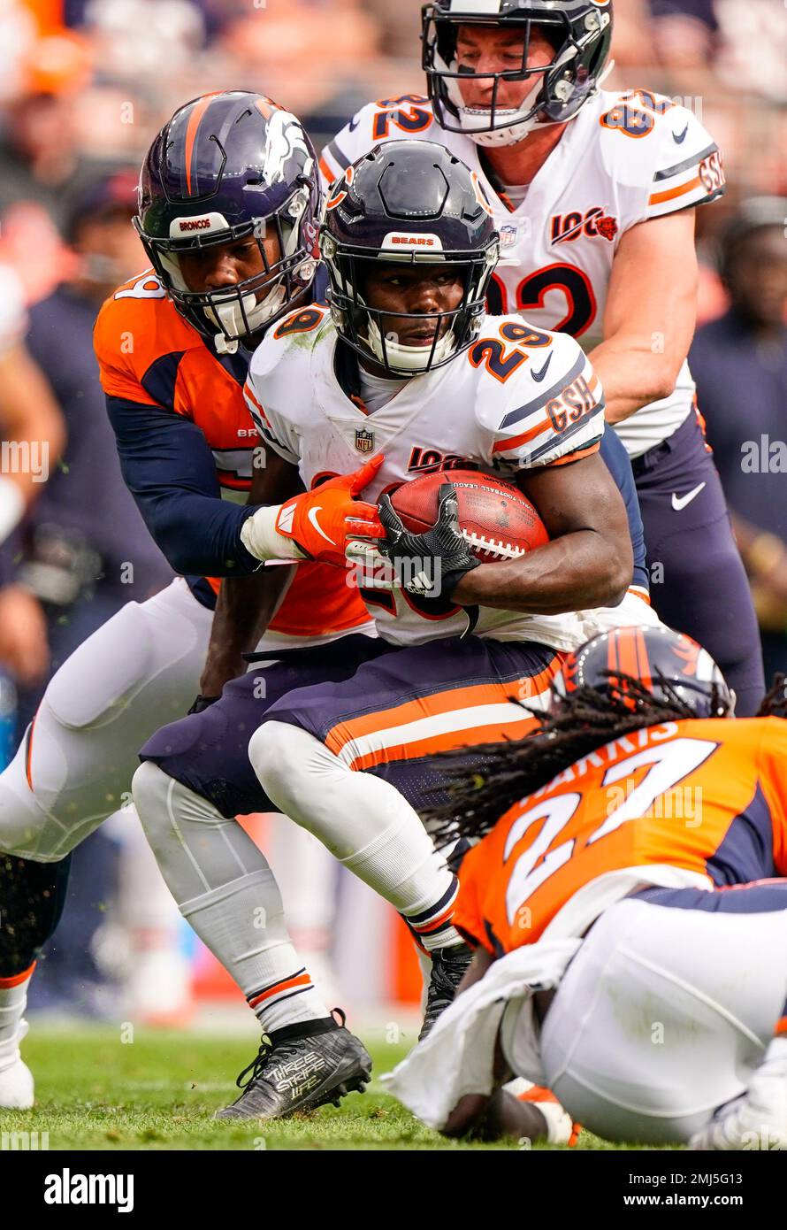 Chicago Bears running back Tarik Cohen (29) is wrapped up by Denver ...
