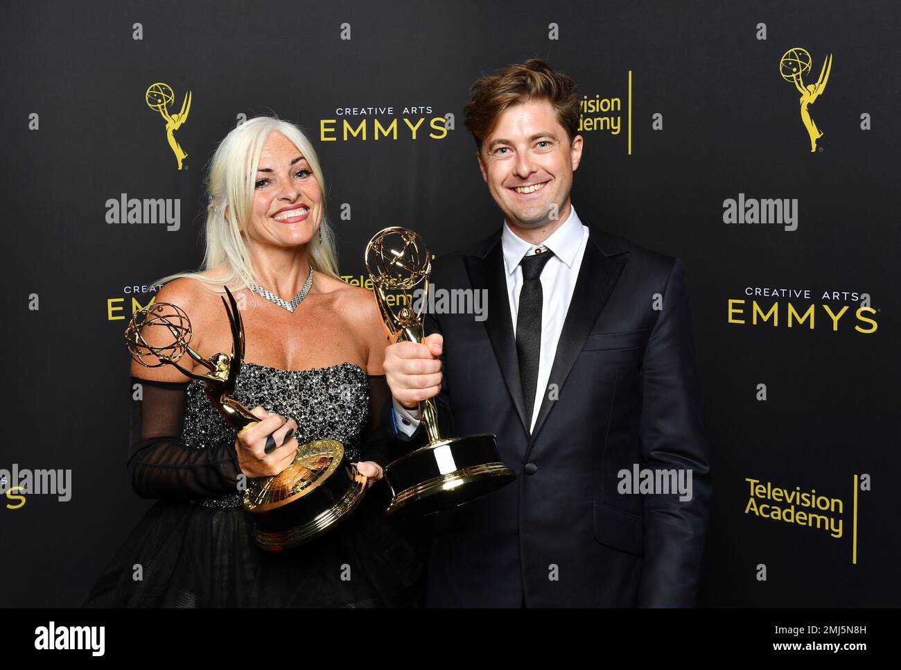 Claire Levinson-Gendler, left, and Luke Hull pose for a portrait with ...