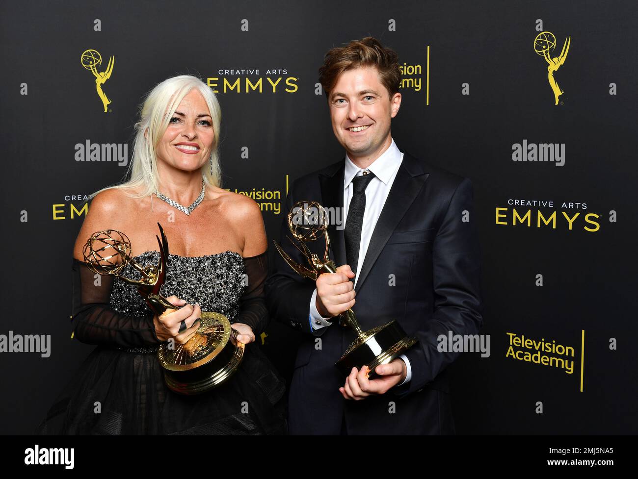 Claire Levinson-Gendler, left, and Luke Hull pose for a portrait with ...