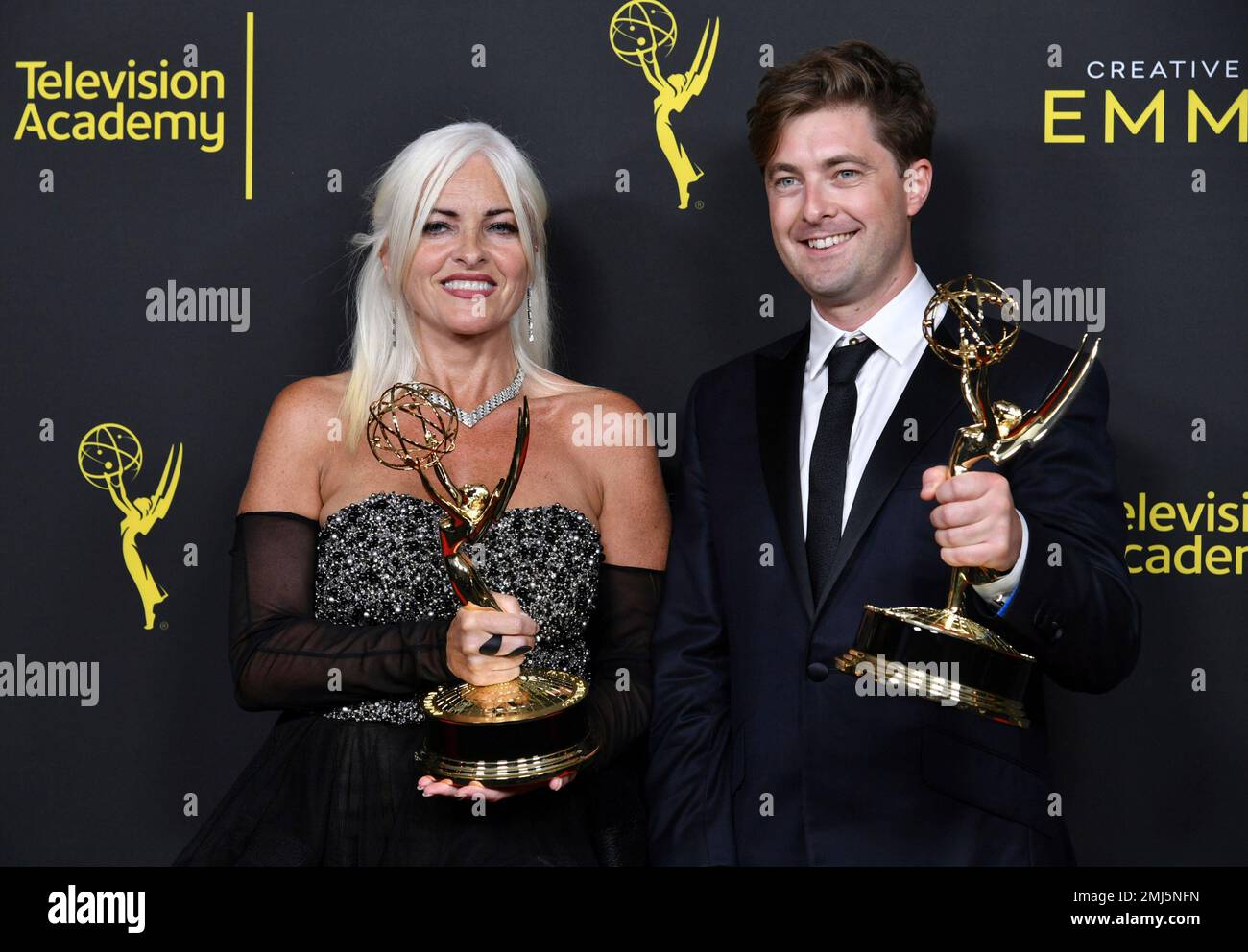 Claire Levinson-Gendler, left, and Luke Hull pose in the press room ...