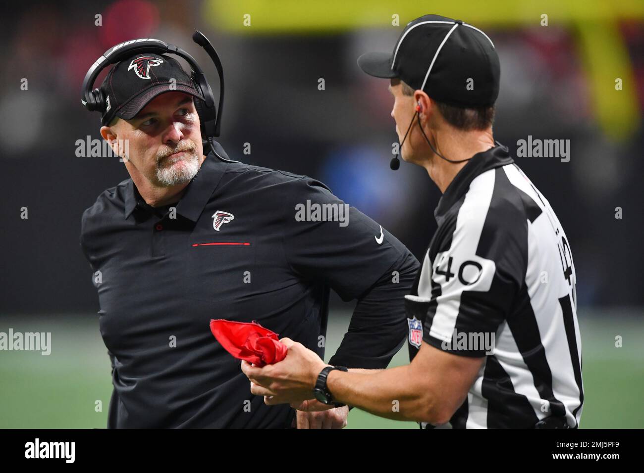 Atlanta Falcons head coach Dan Quinn speaks with umpire Butch Hannah ...