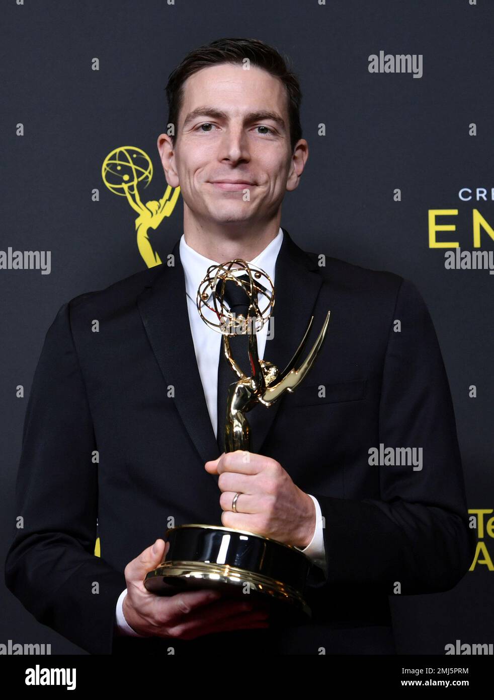Chris Teague poses in the press room with the award for outstanding ...