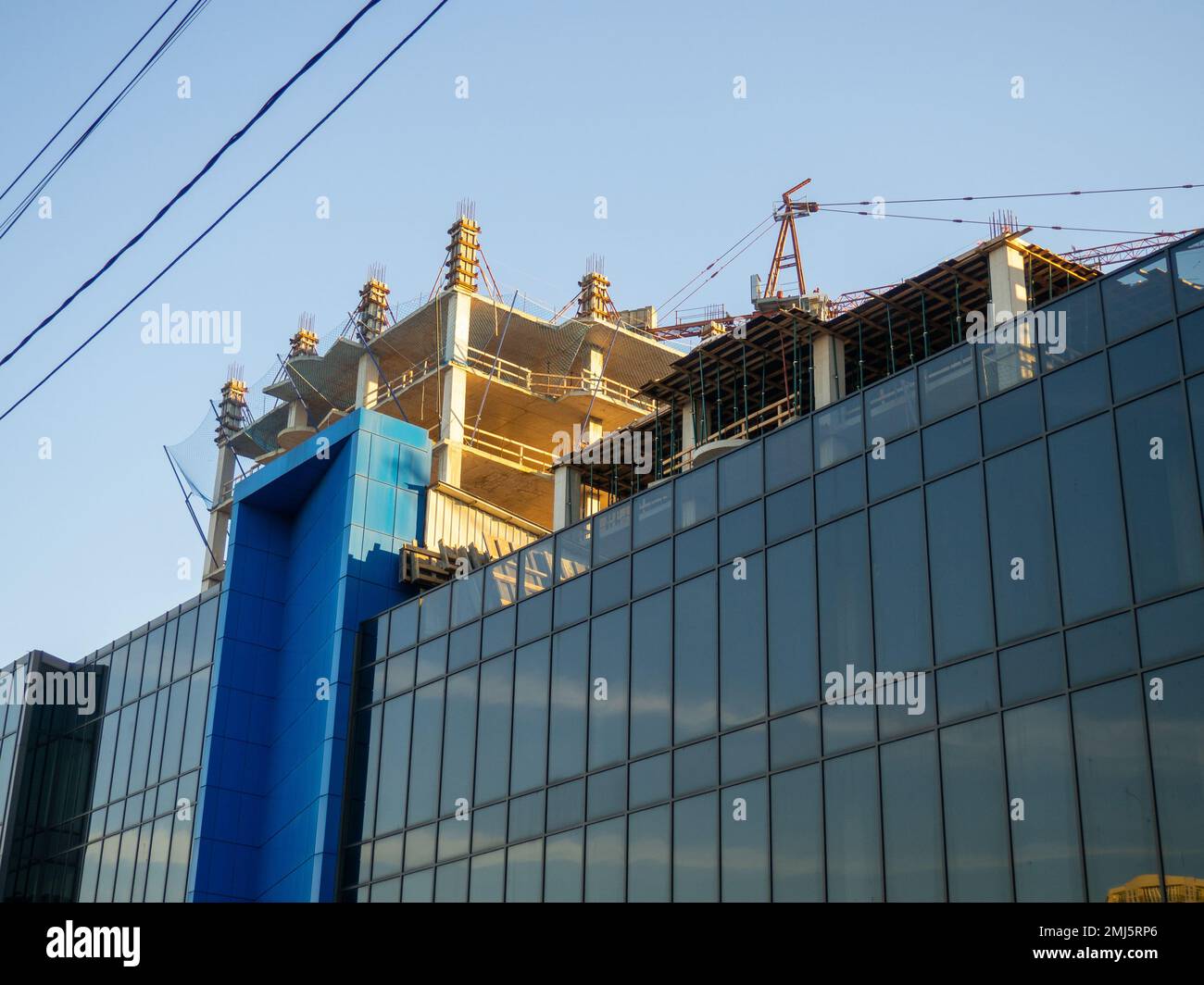 Construction of houses in a modern city. Construction of high-rise ...