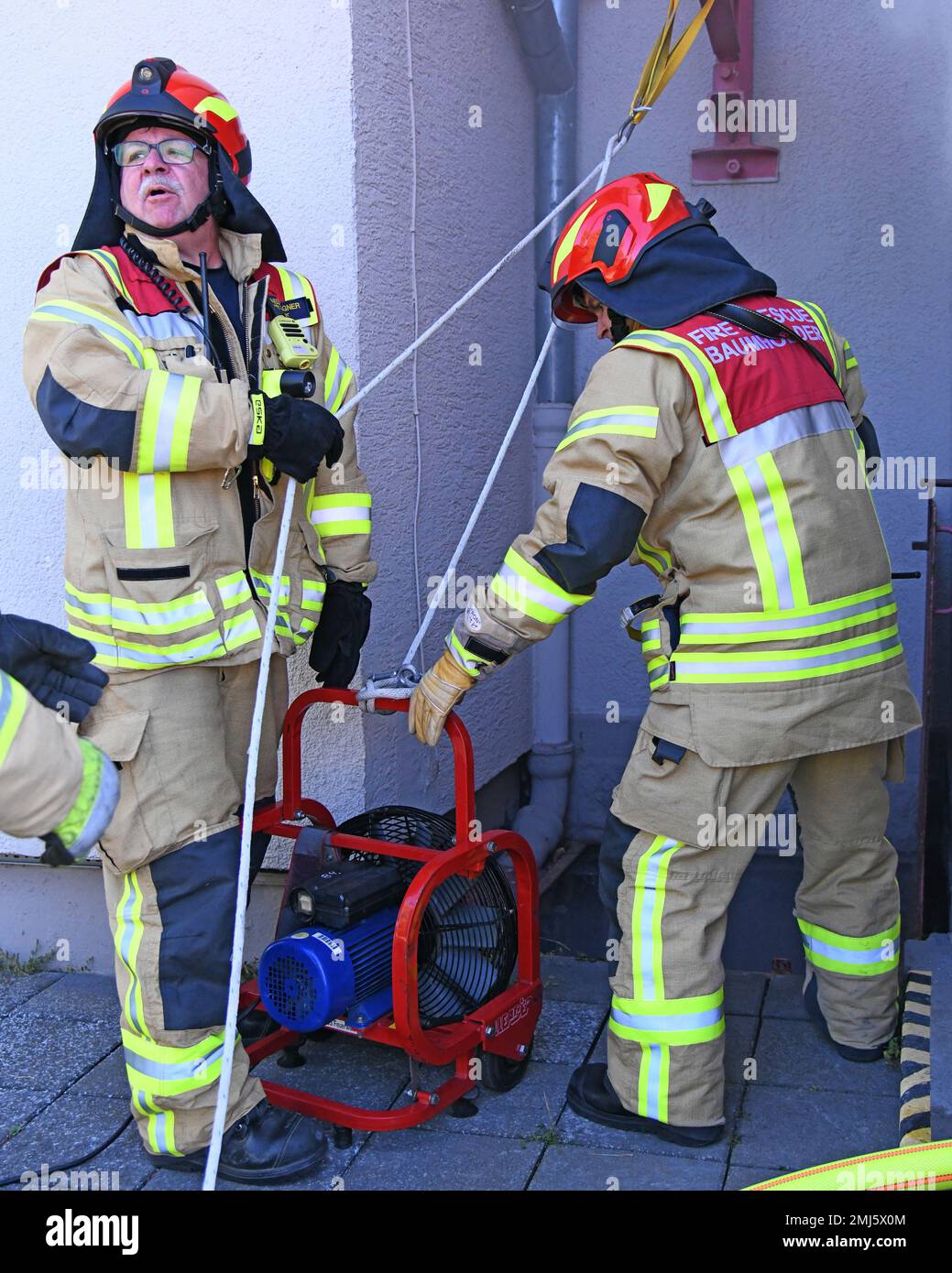 U.S. Army Garrison Fire Department member prepares air fan for ...