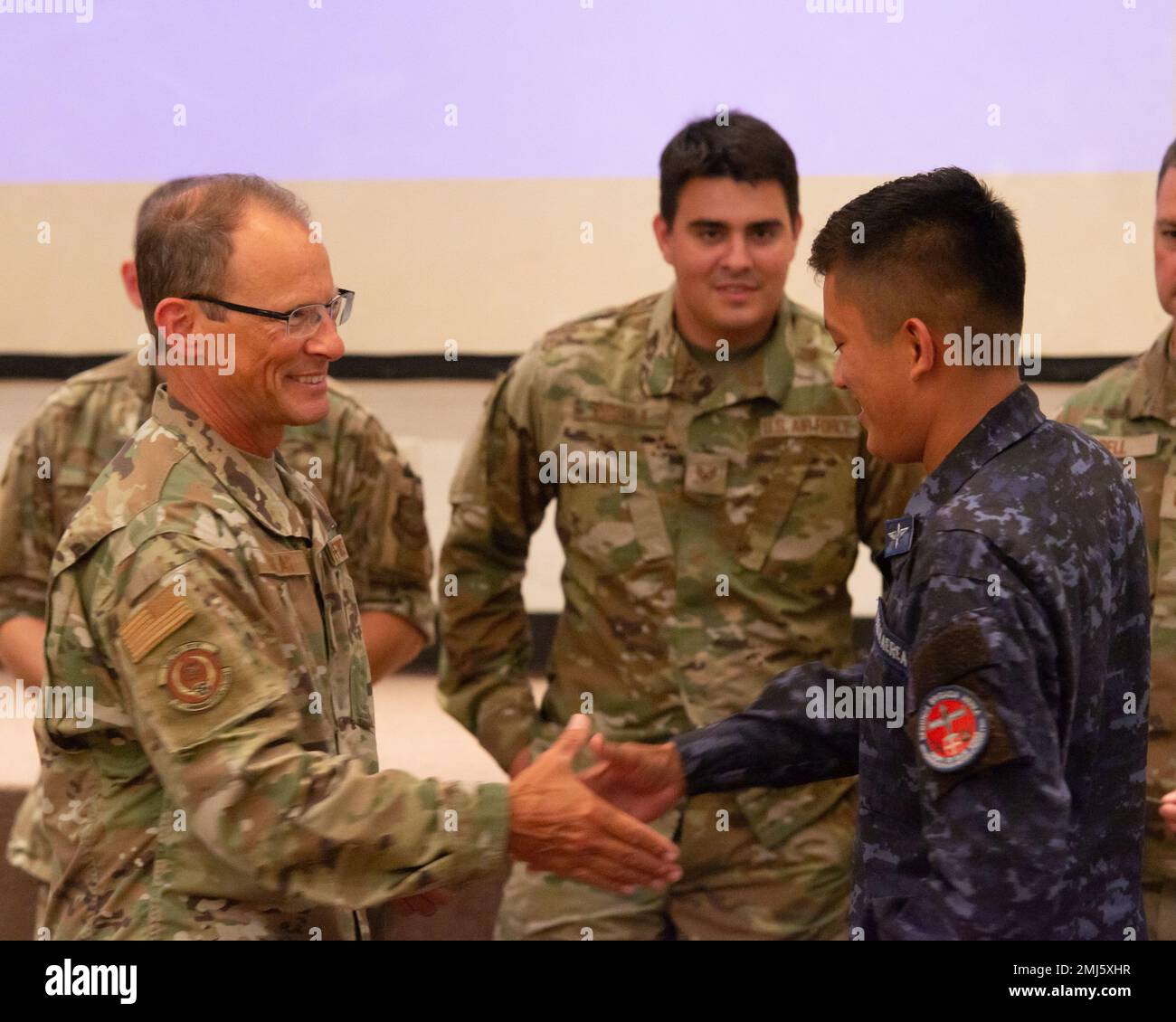 Airmen, Soldiers and civilians from El Salvador and the New Hampshire National Guard exchange ...
