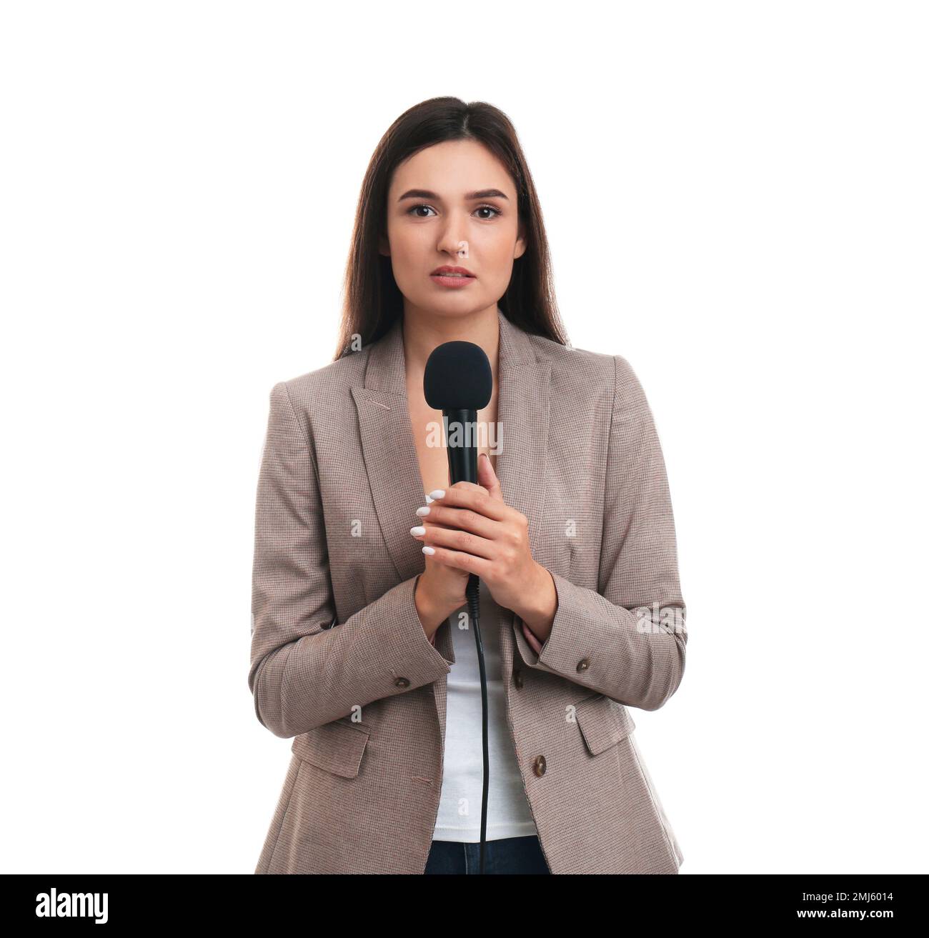 Young female journalist with microphone on white background Stock Photo ...