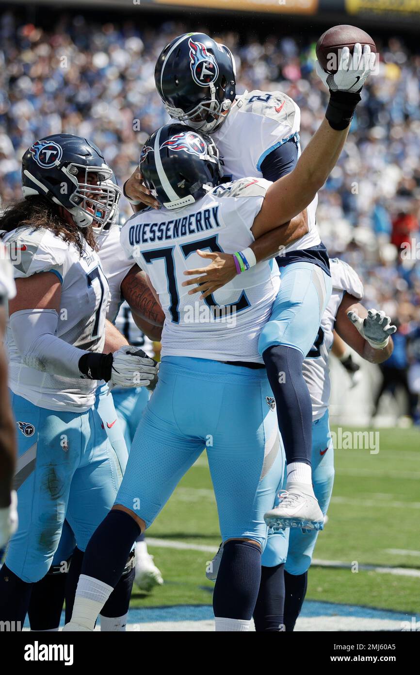 Tennessee Titans' David Quessenberry (72) celebrates with quarterback ...