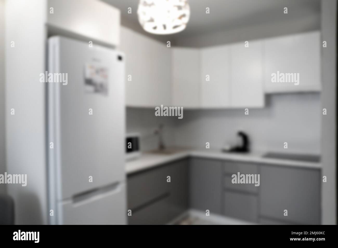 Blurred view of stylish modern kitchen interior Stock Photo - Alamy