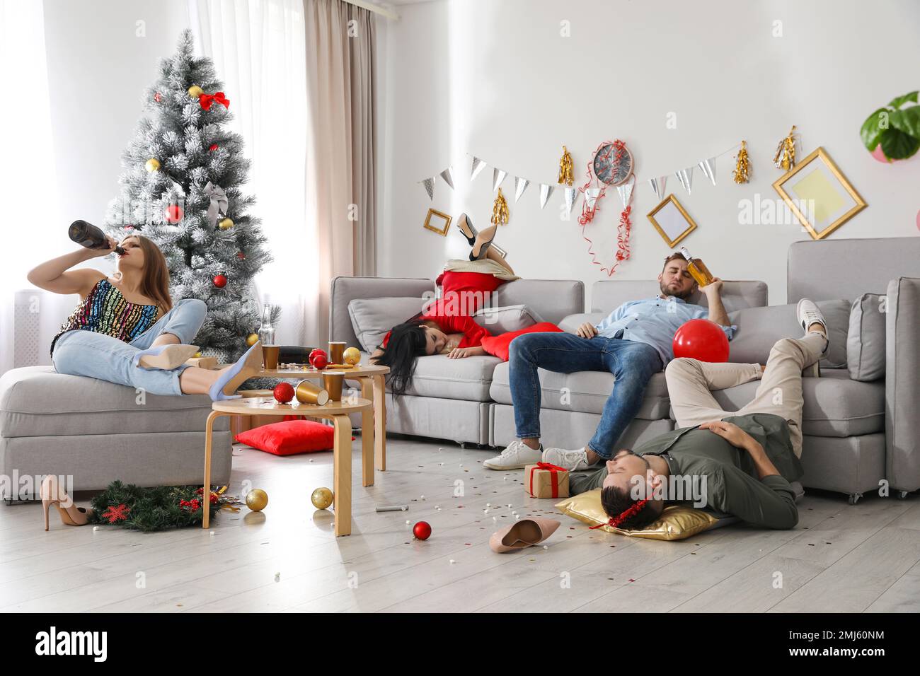 Drunk friends in messy room after New Year party Stock Photo - Alamy