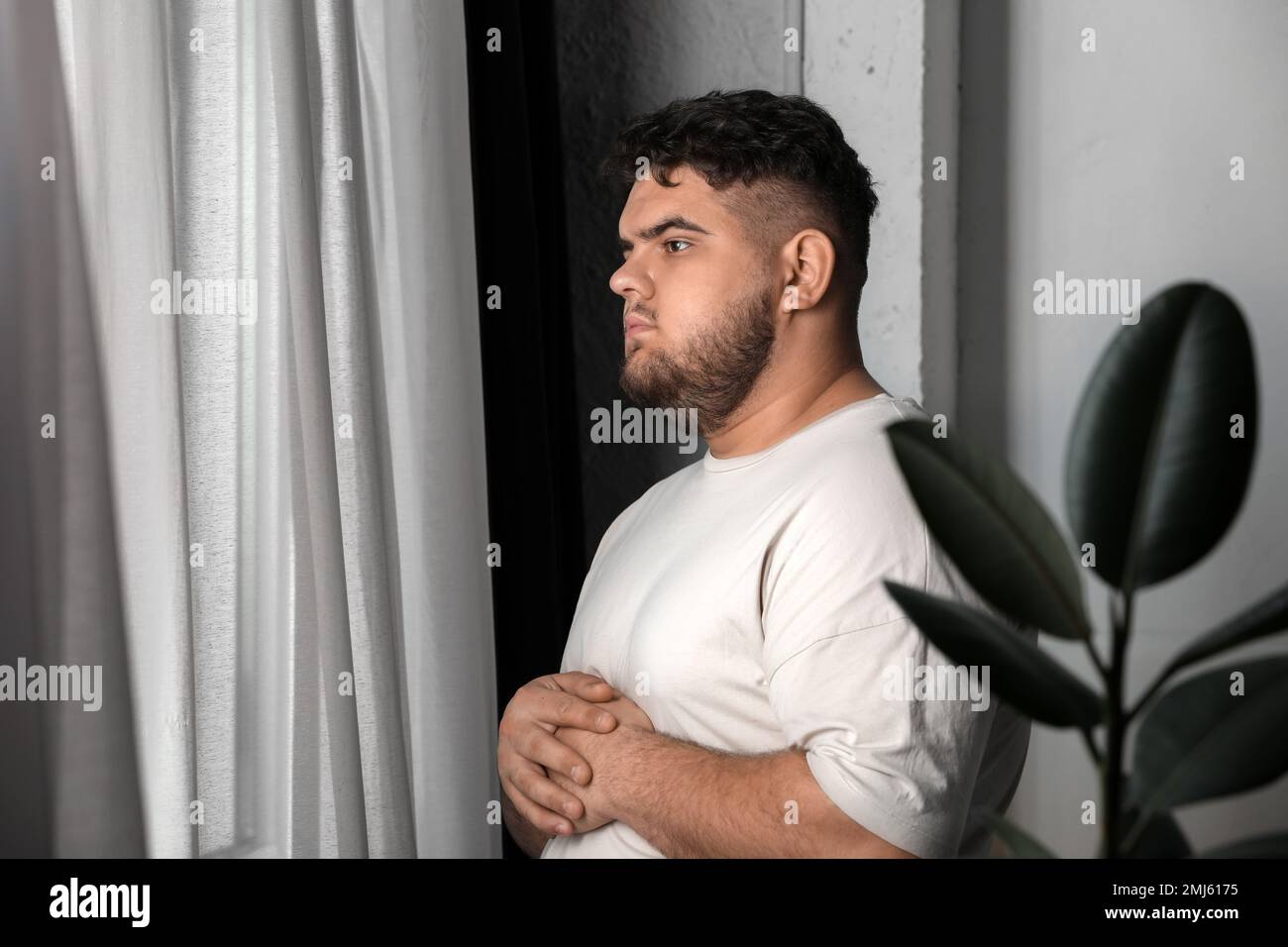 Sad overweight man home hi-res stock photography and images - Alamy