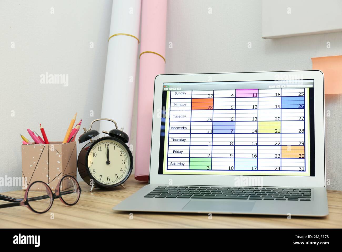 Modern laptop with calendar on screen in office Stock Photo - Alamy