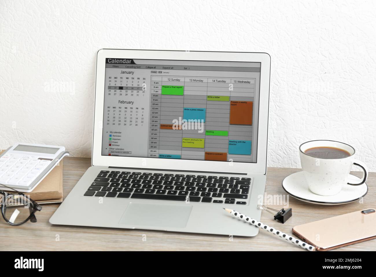 Modern laptop with calendar app in office Stock Photo - Alamy