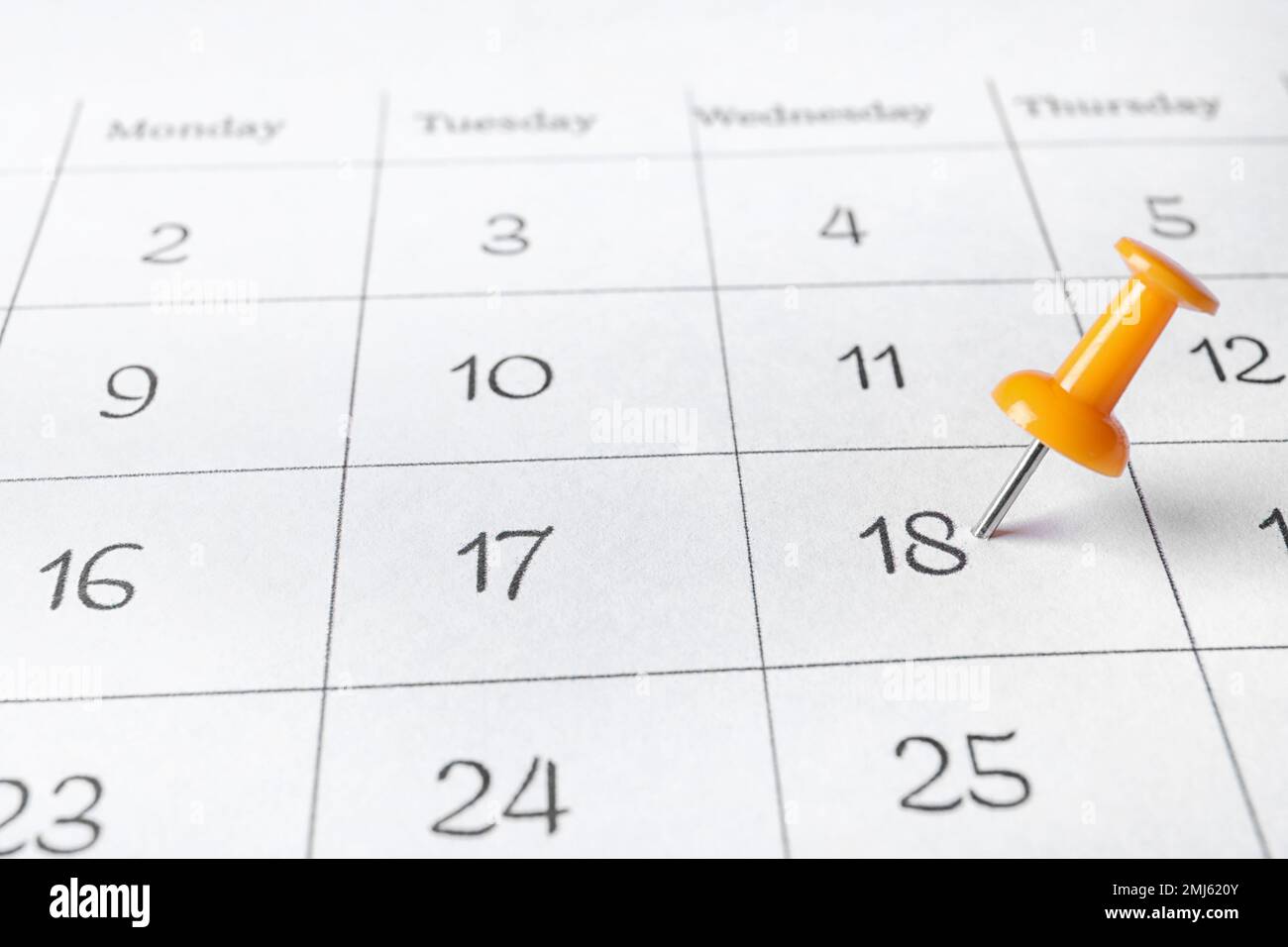 Calendar page marked with drawing pin, closeup Stock Photo - Alamy