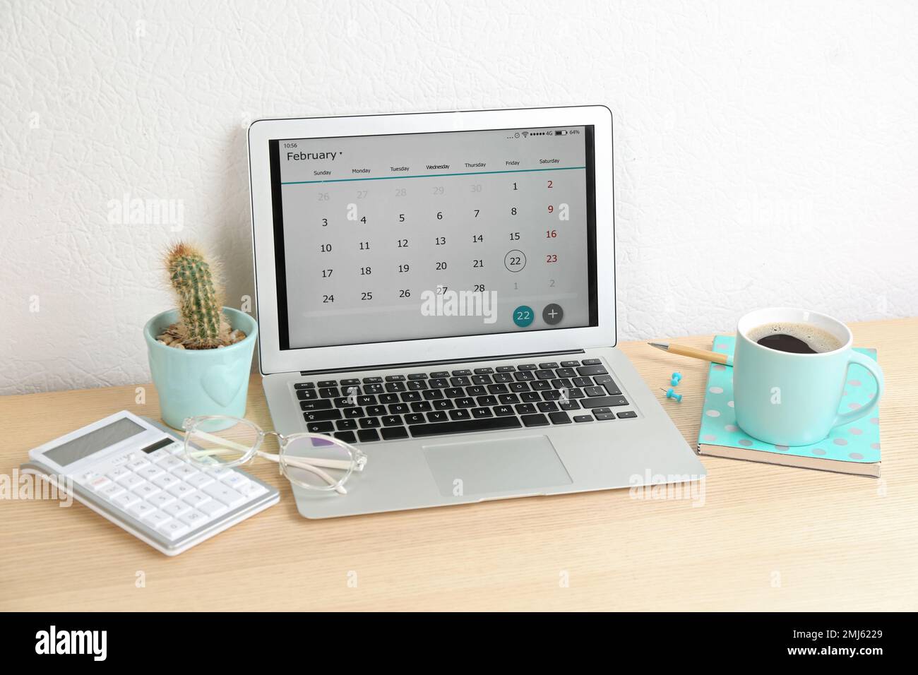 Modern laptop with calendar app in office Stock Photo - Alamy