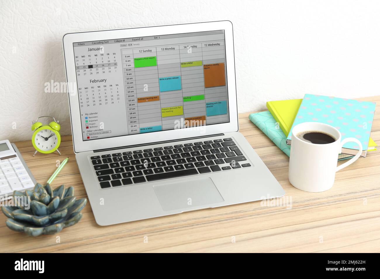 Modern laptop with calendar app in office Stock Photo - Alamy