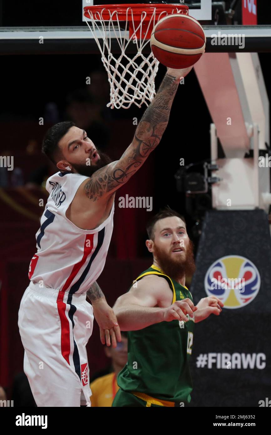 Vincent Poirier of France and Aron Baynes of Australia in action during ...
