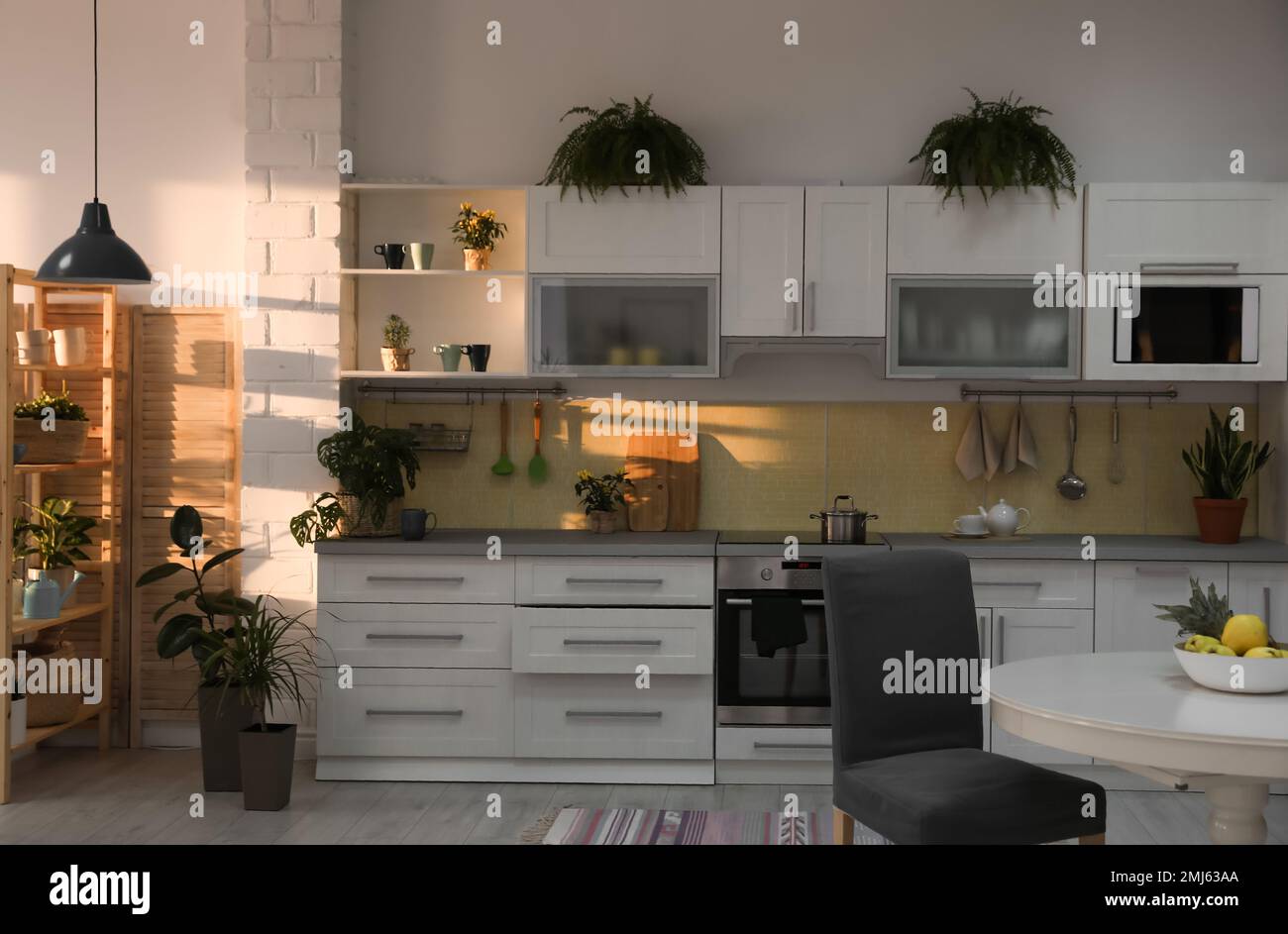 Stylish kitchen interior with green plants. Home decoration Stock Photo ...
