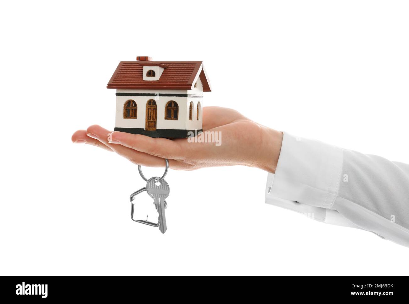Real estate agent holding house model and key on white background ...