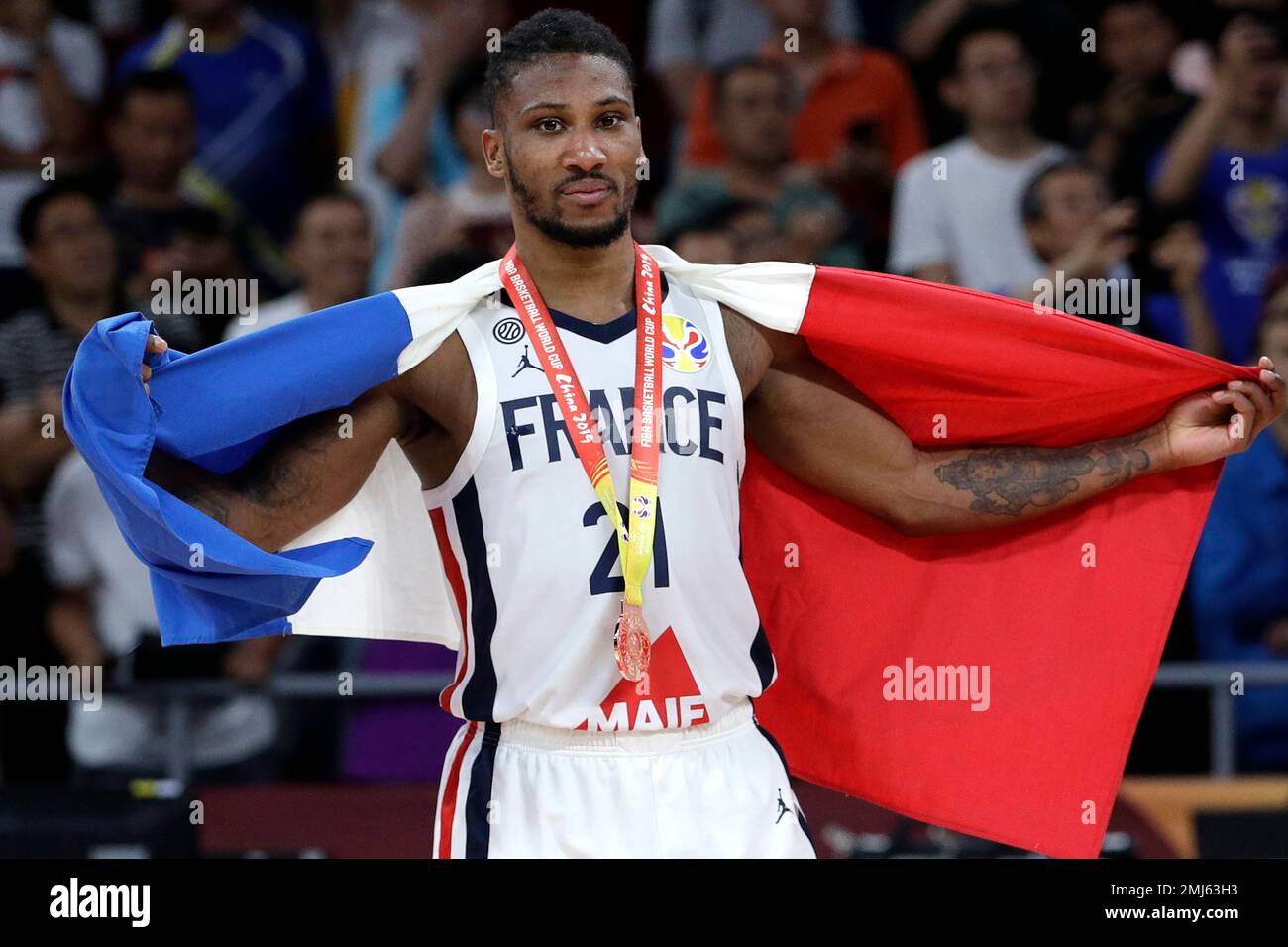 Andrew Albicy of France stands with his bronze medal after France beat ...