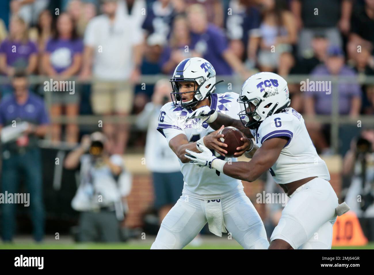 TCU quarterback Alex Delton (16) hands off to TCU running back Darius ...