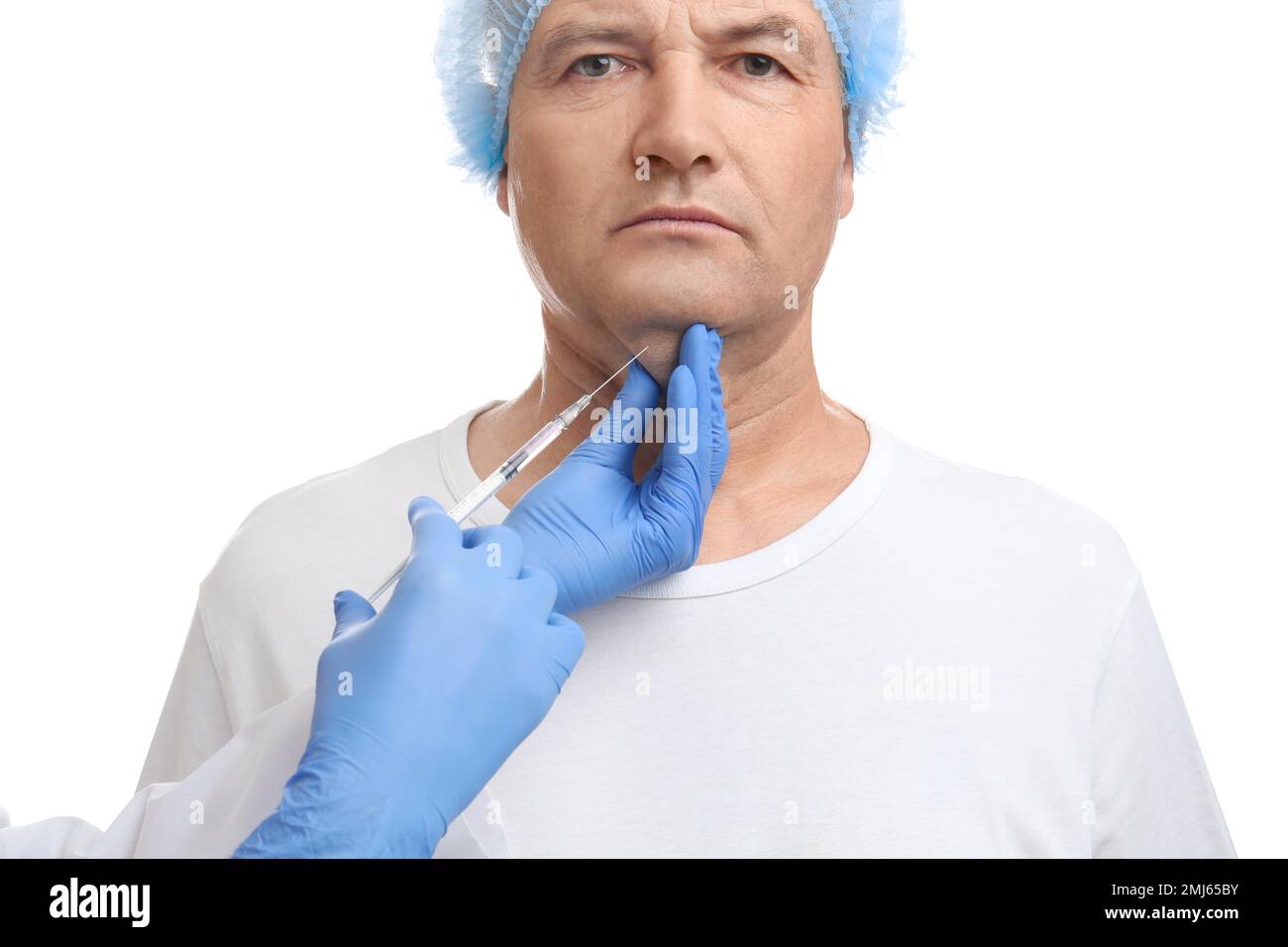 Mature man with double chin receiving injection on white background ...
