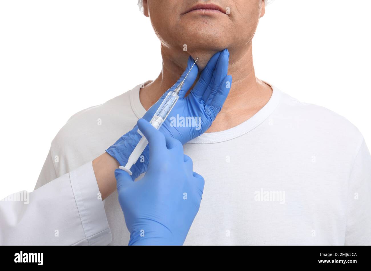 Mature man with double chin receiving injection on white background ...