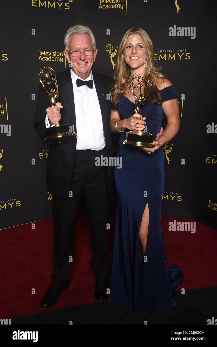 Keith Scholey, left, and Sophie Lanfear poses with the award for ...