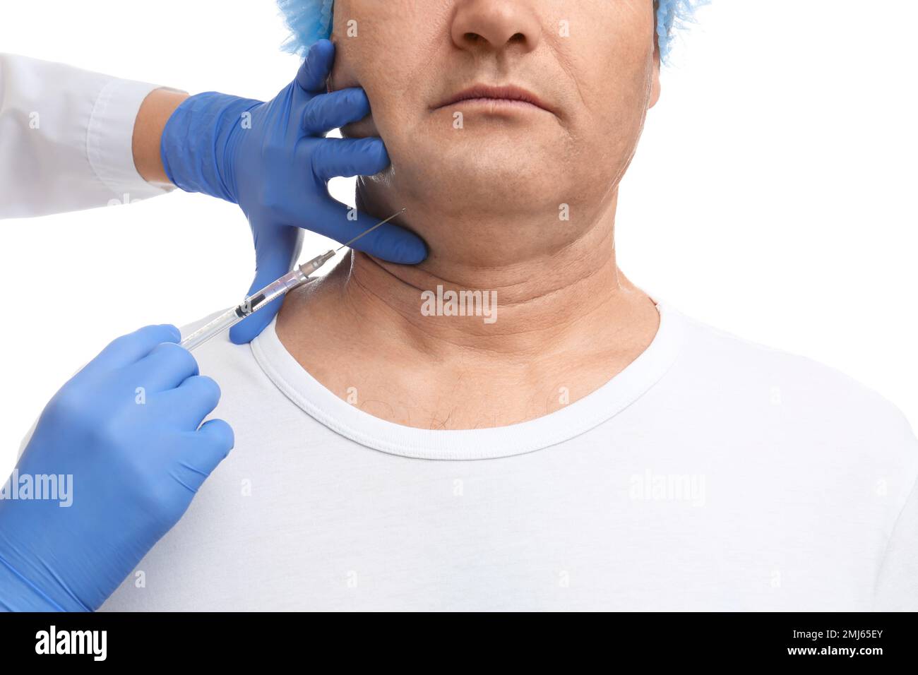 Mature man with double chin receiving injection on white background ...