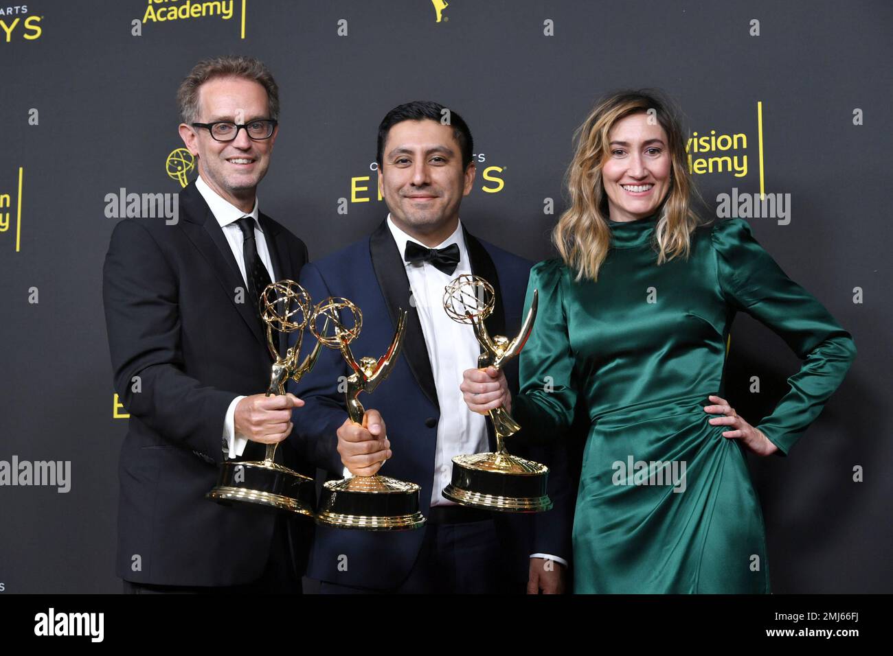 Sam Bisbee, from left, Rudy Valdez, and Theodora Dunlap pose in the press room with their awards ...
