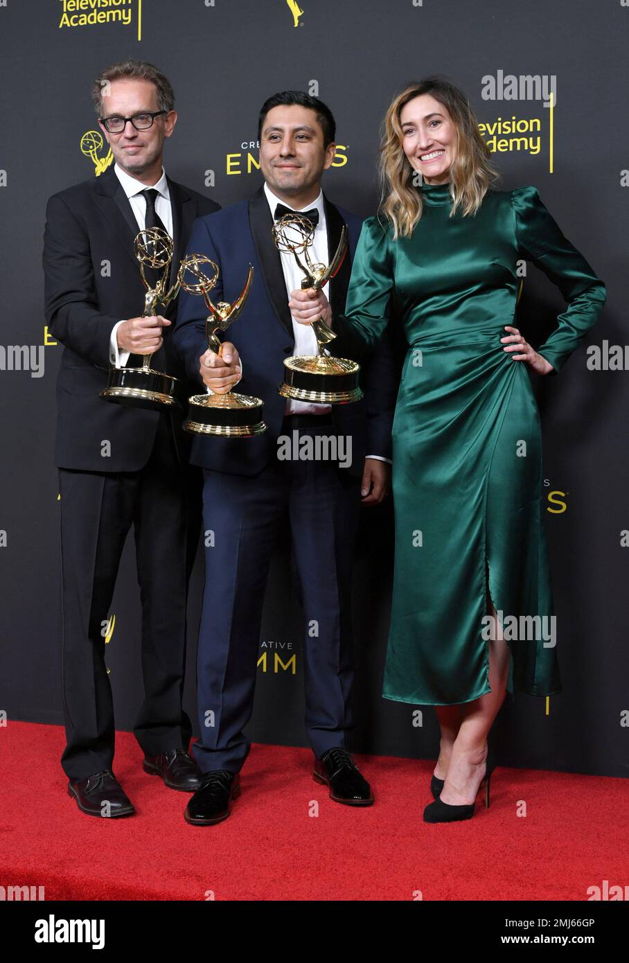 Sam Bisbee, from left, Rudy Valdez, and Theodora Dunlap pose in the press room with their awards ...