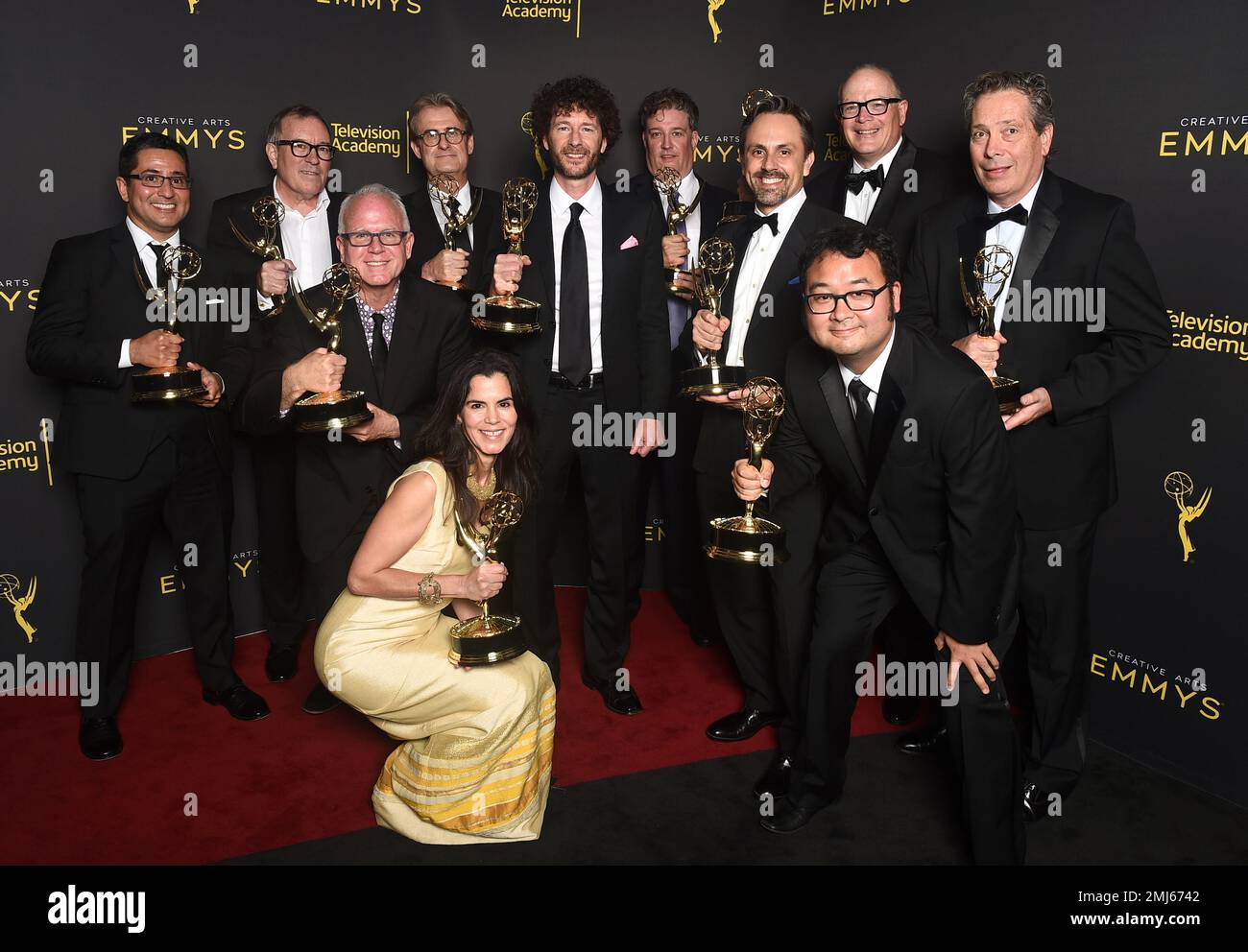 The team from "The Simpsons" poses with the award for outstanding ...