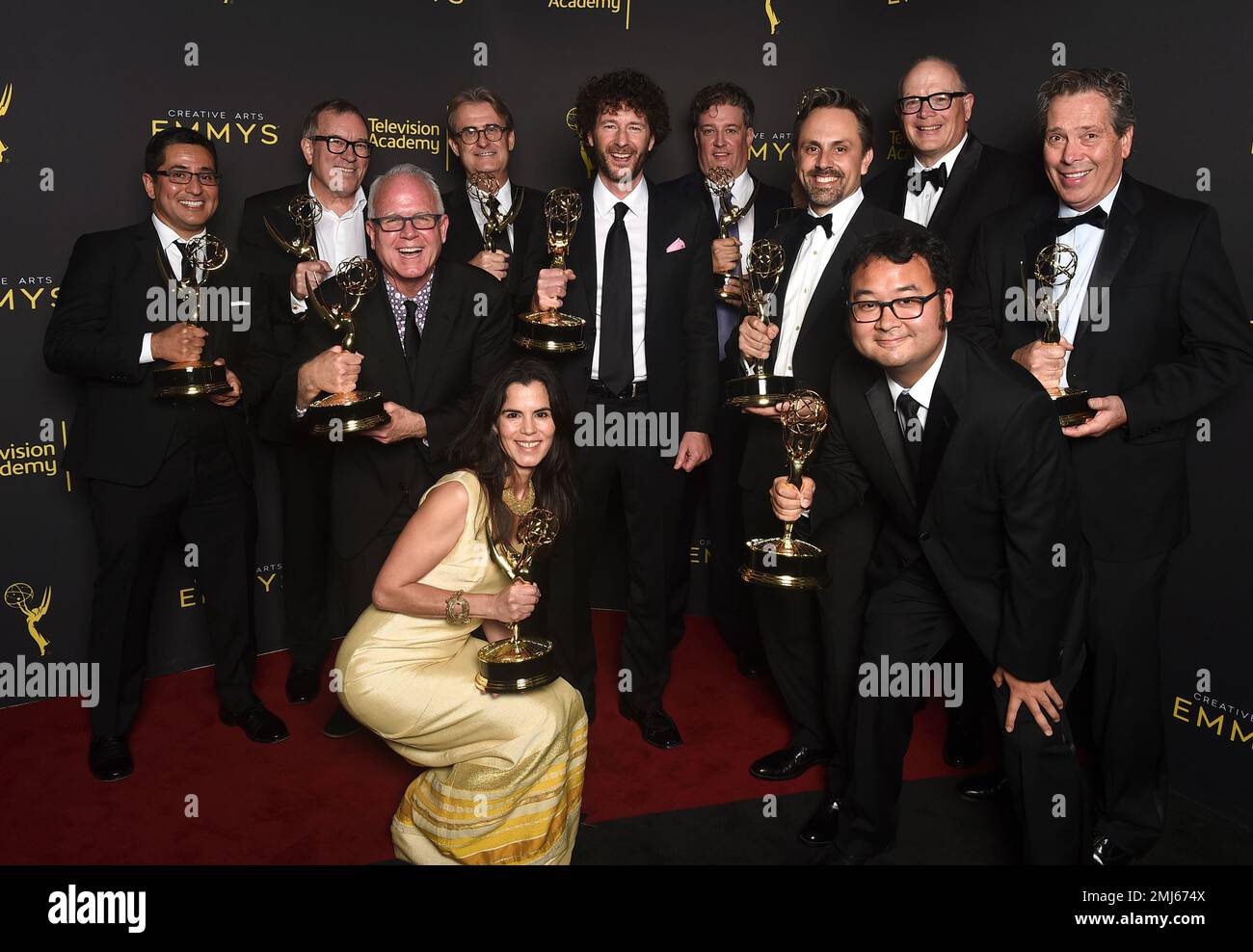 The team from "The Simpsons" poses with the award for outstanding ...