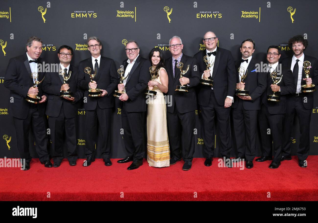 The crew from "The Simpsons" poses in the press room with their awards ...