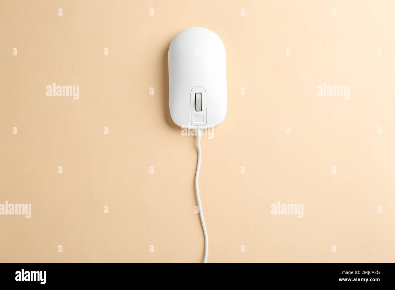 Modern wired optical mouse on beige background, top view Stock Photo ...
