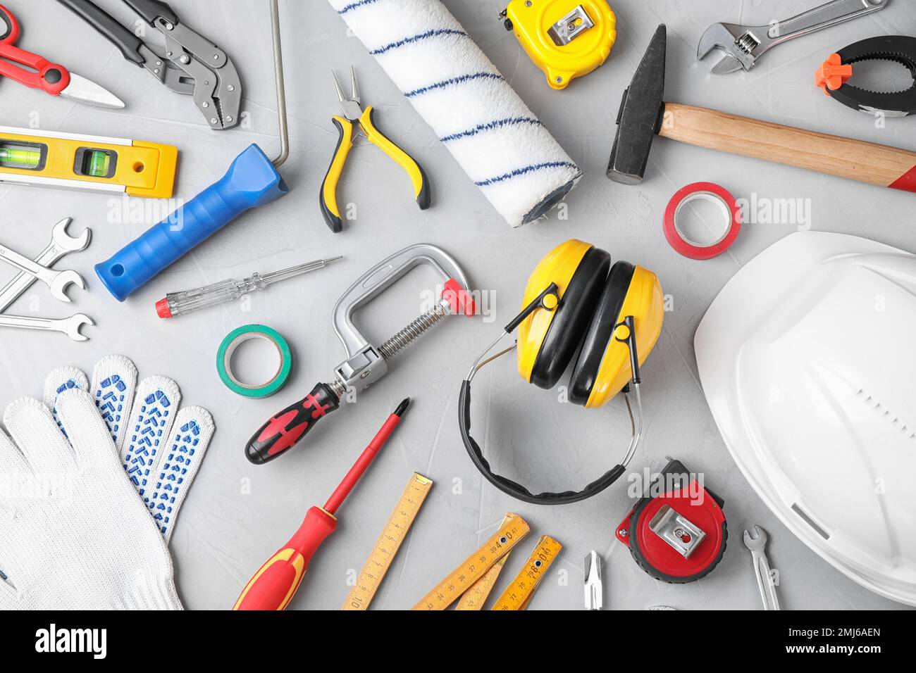 Flat lay composition with construction tools on light grey background ...