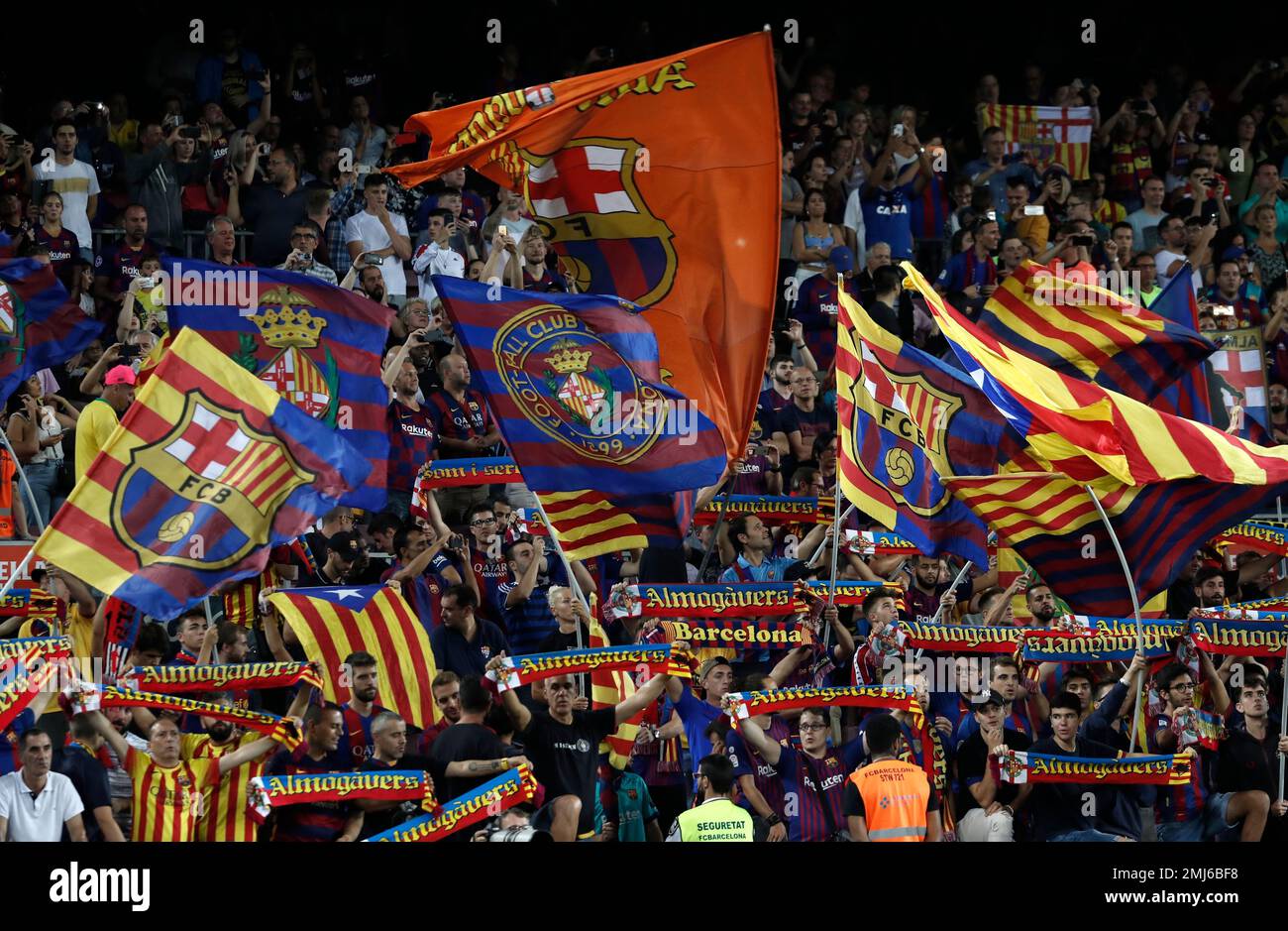 Barcelona fans cheer their team during the Spanish La Liga soccer match ...