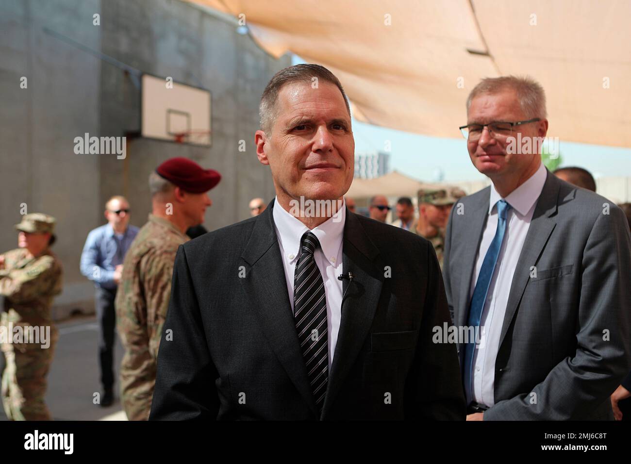Matthew Tueller, center, the U.S. ambassador to Iraq, attends a ...